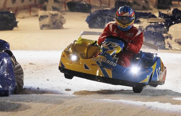 Ferrari Formula One driver Fernando Alonso rides an ice kart in Madonna ...